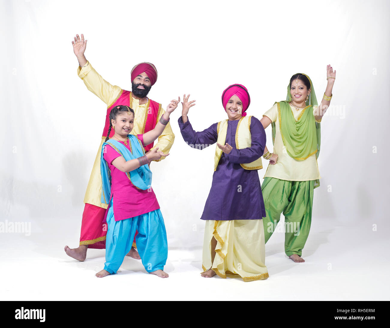 PORTRAIT OF A SIKH SARDAR FAMILY OF FOUR DANCING THE BANGRA DANCE IN ...
