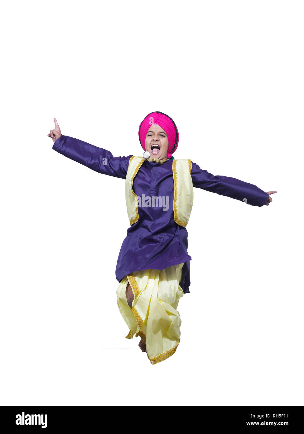 PORTRAIT OF A YOUNG SARDAR BOY JUMPING DRESSED IN TRADITIONAL BHANGRA ...