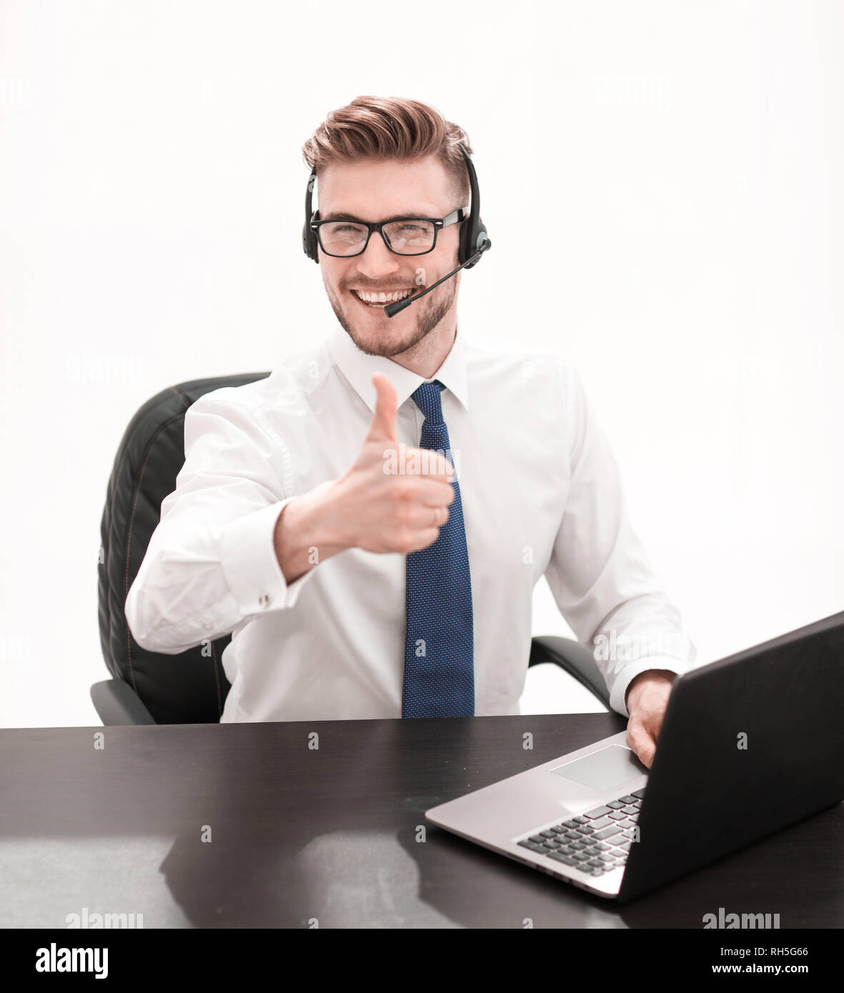 smiling employee of the business centre showing thumb up Stock Photo ...