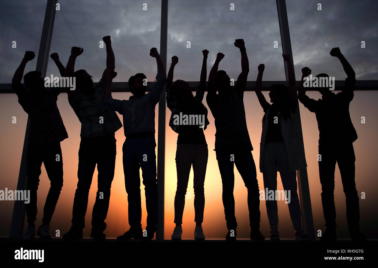 friendly business team standing near the office window Stock Photo - Alamy