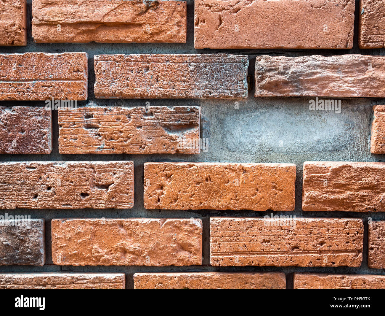 Close-up brick wall background with missing brick. Empty space from ...
