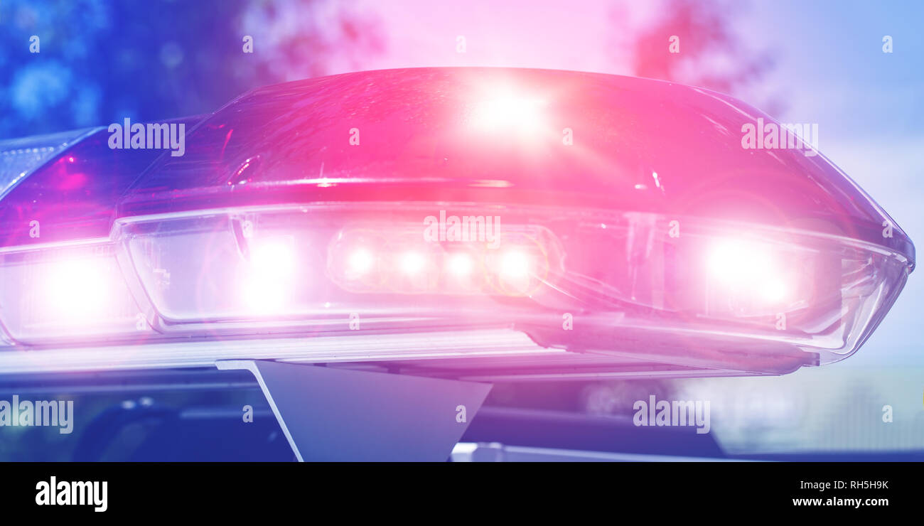 Red light flasher of a patrol police car at night. Night patrolling of ...