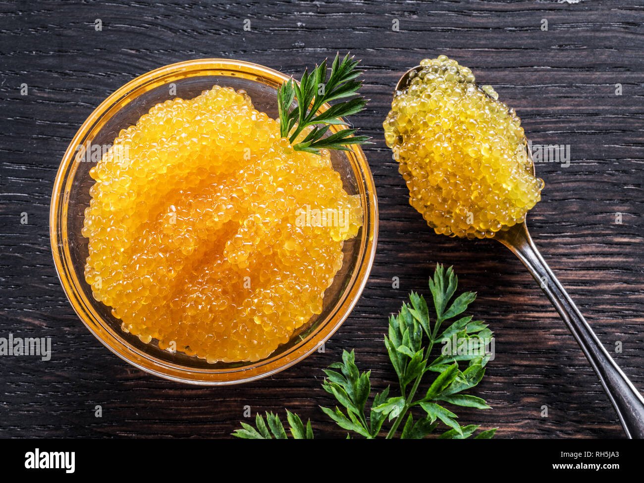Pike caviar or roe in the bowl on wooden background Stock Photo - Alamy