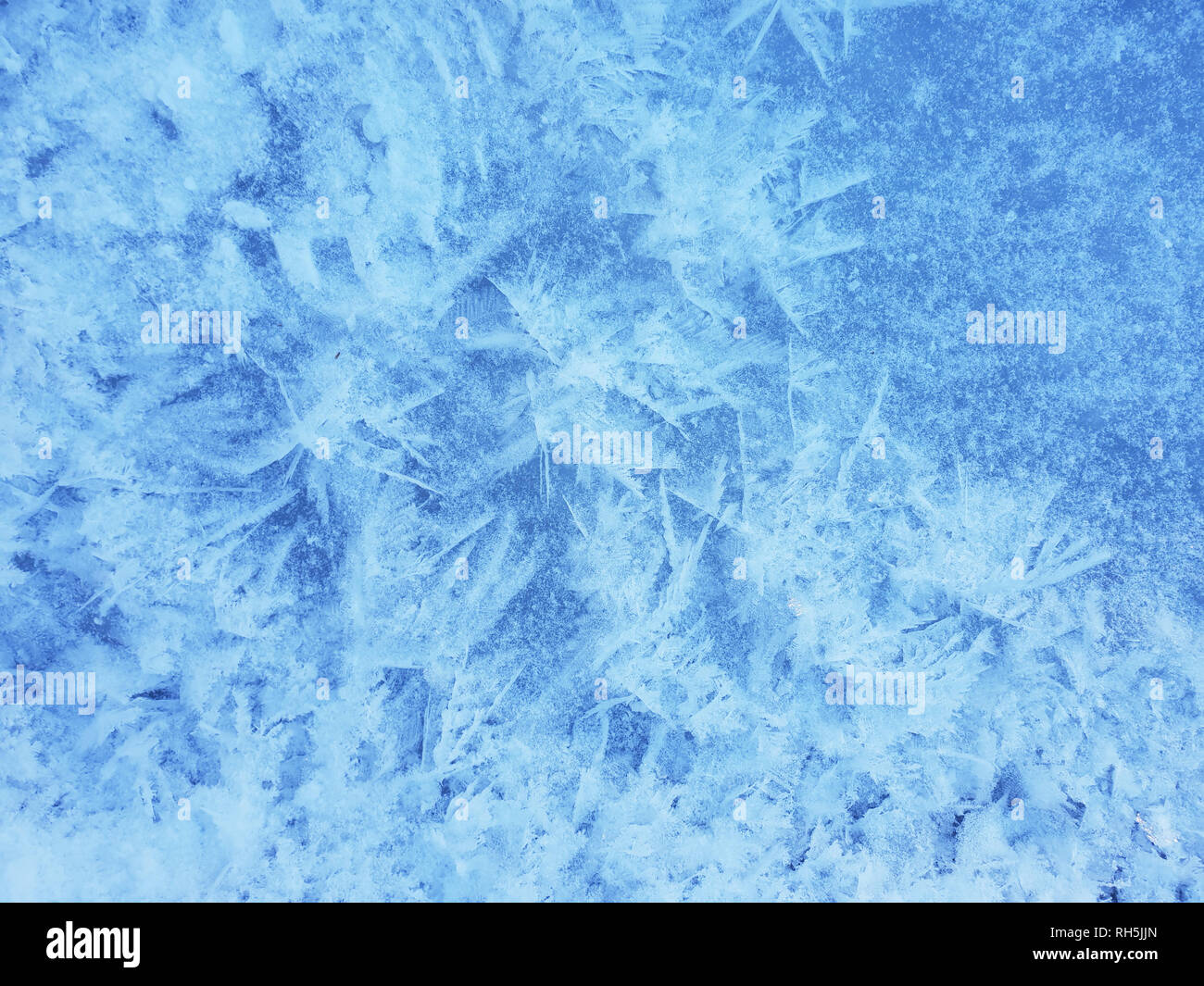 Snow crystals form beautiful snow pattern on frozen icy river ...