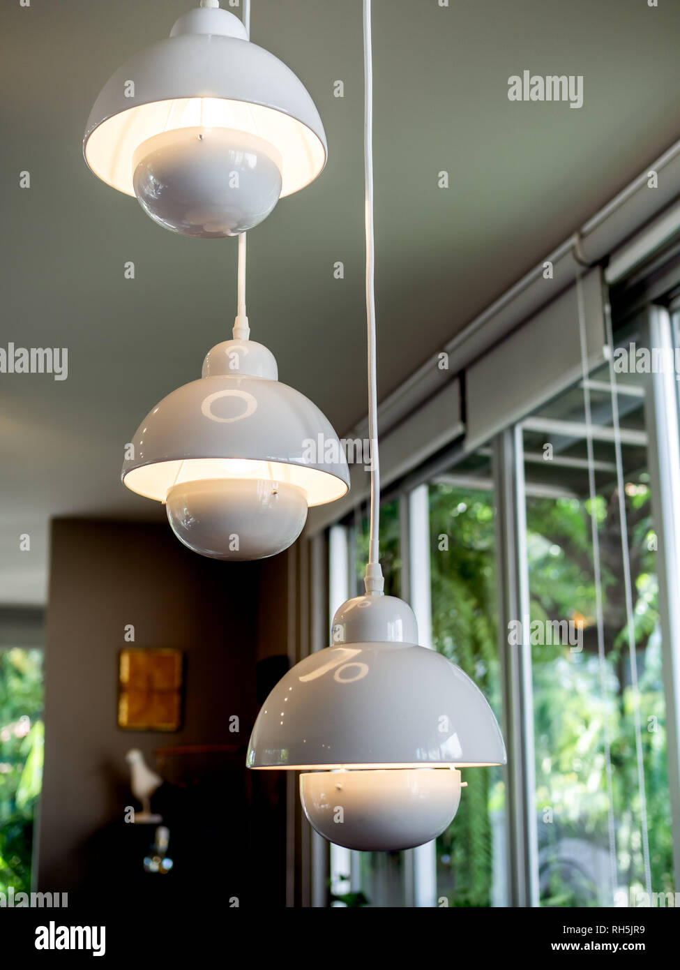 White ceiling lights decoration in cafe. White modern electric lamps ...