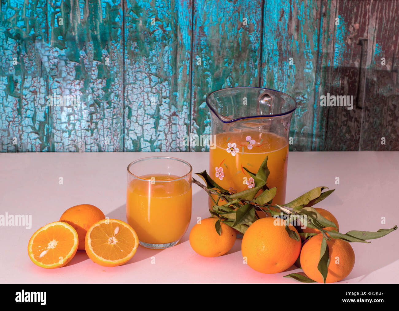 orange split in half with a glass and a jug of orange juice Stock Photo ...