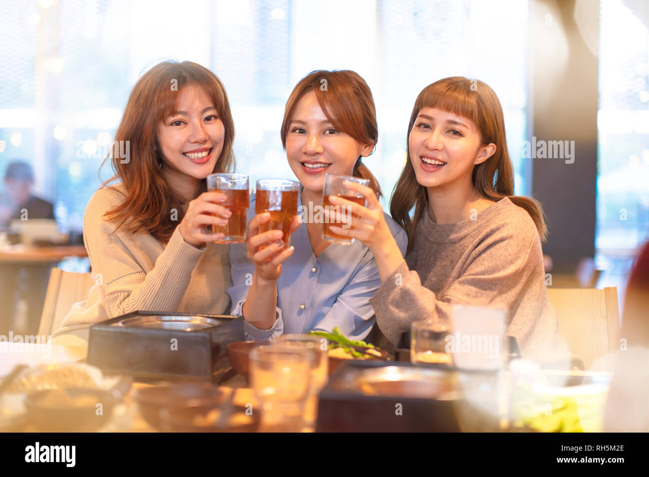 happy young people friends toasting and eating in the restaurant Stock ...