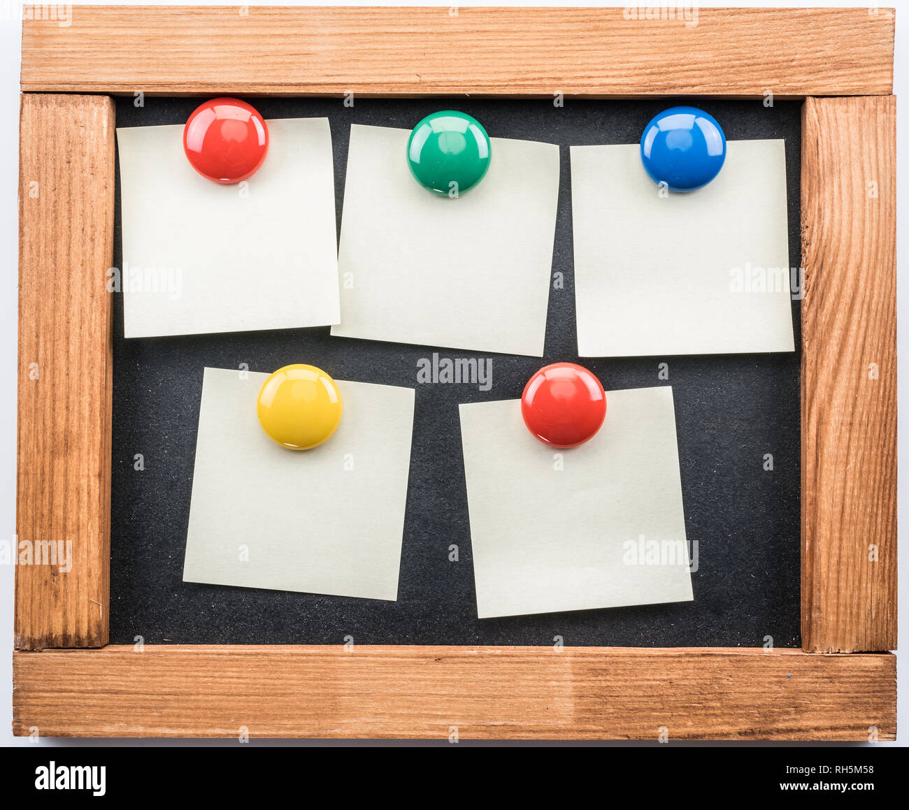 Blackboard and post-it notes stuck with colorful magnets Stock Photo ...