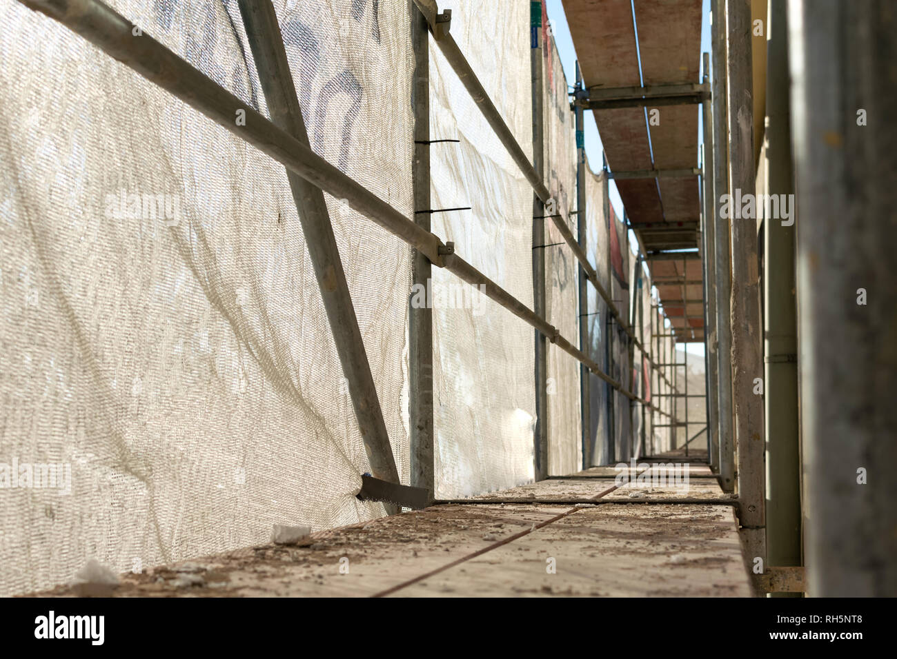 Metal scaffolding set up next to the building during facade renovation ...