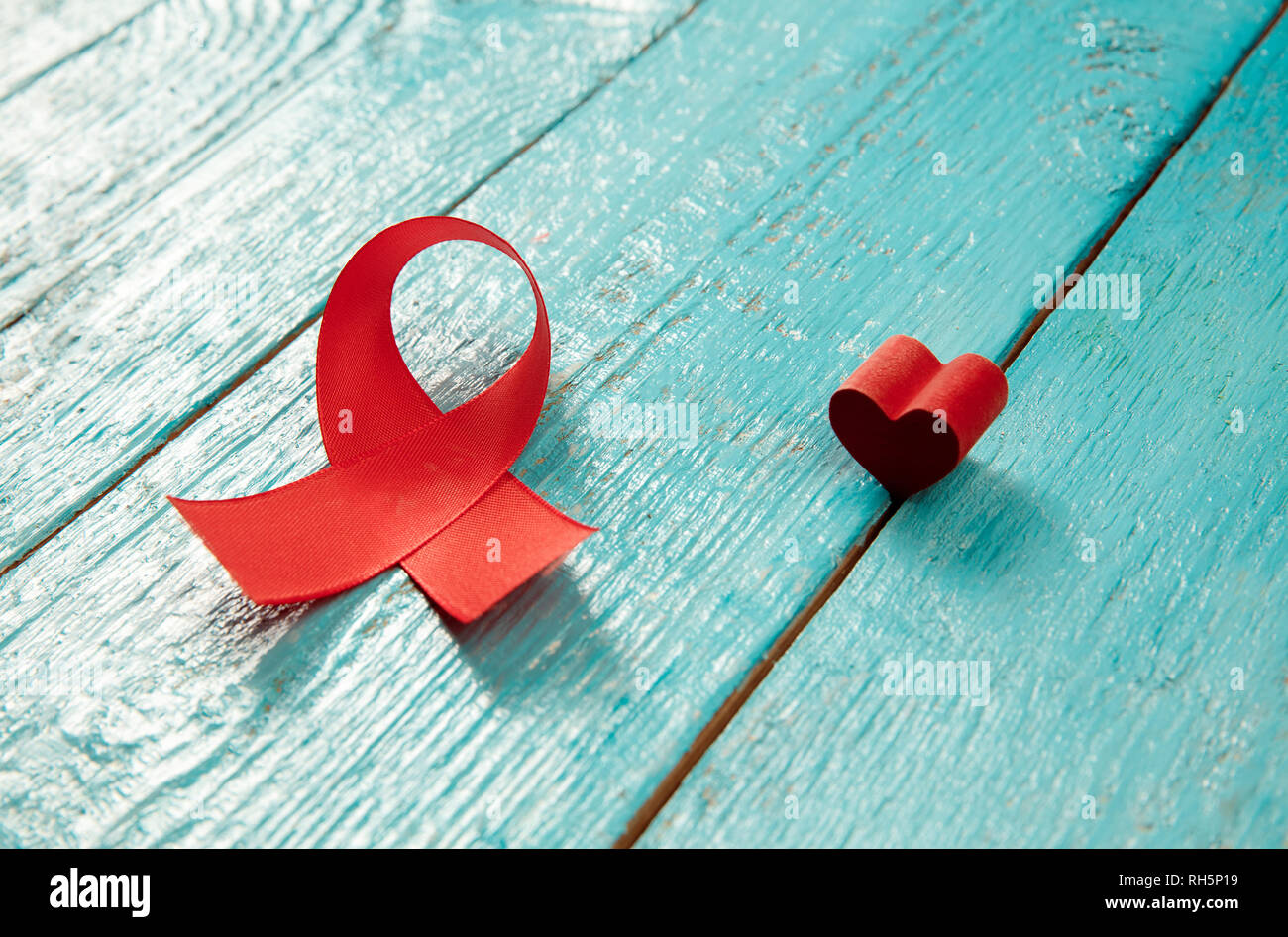 Aids Awareness Sign Red Ribbons on blue wooden background . World Aids ...