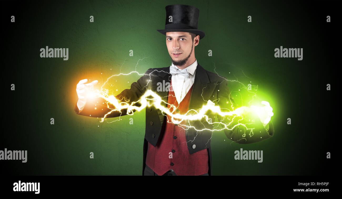 Magician sparkling super power between his two hands Stock Photo - Alamy