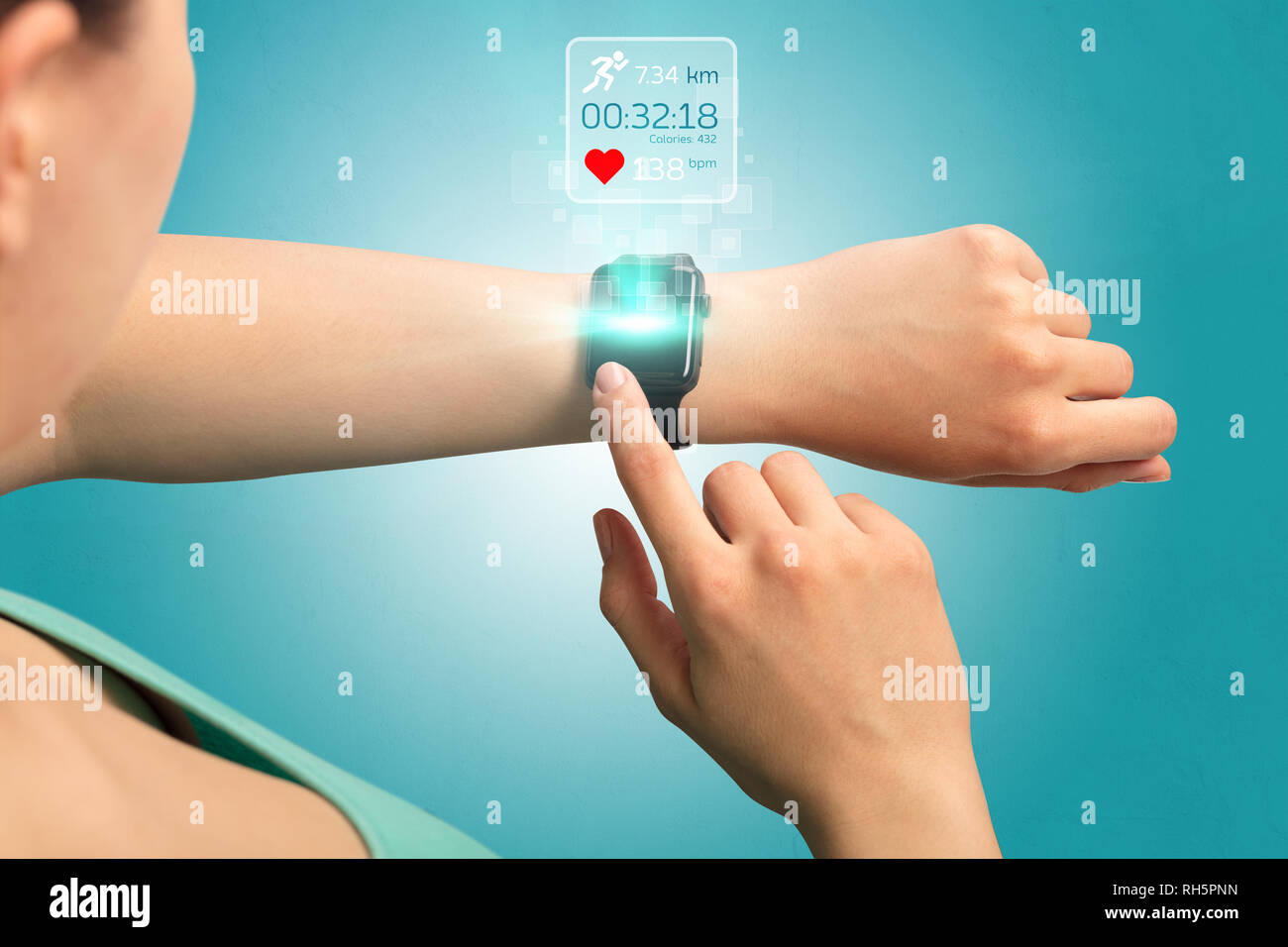 Female hand with smartwatch and running concept above Stock Photo - Alamy