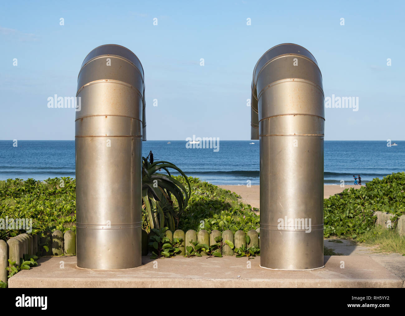 Two big air pipes for drain-ventilation on the sidewalk of the beach ...