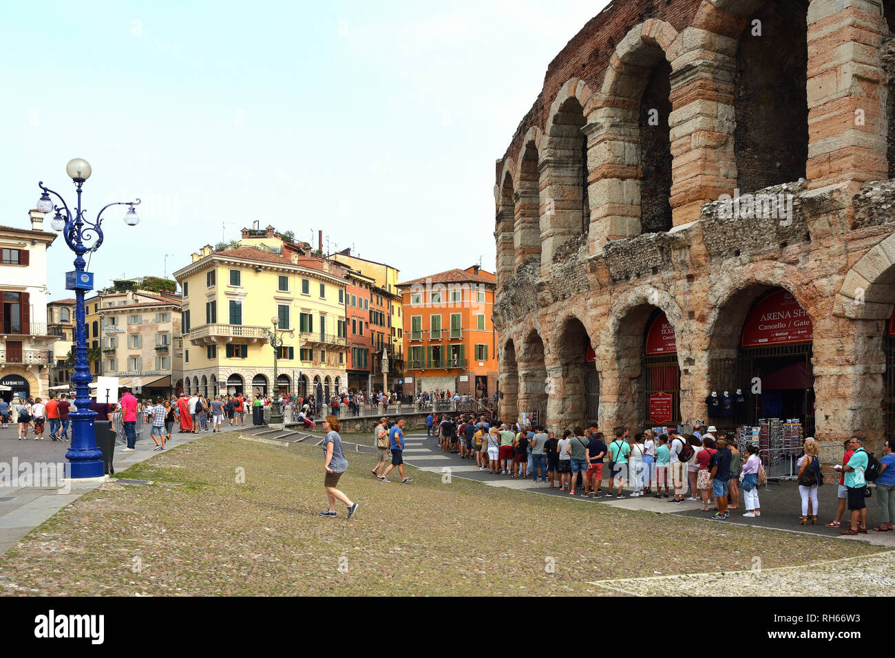 Visitors in front of the main entrance to the Roman amphitheatre Arena ...
