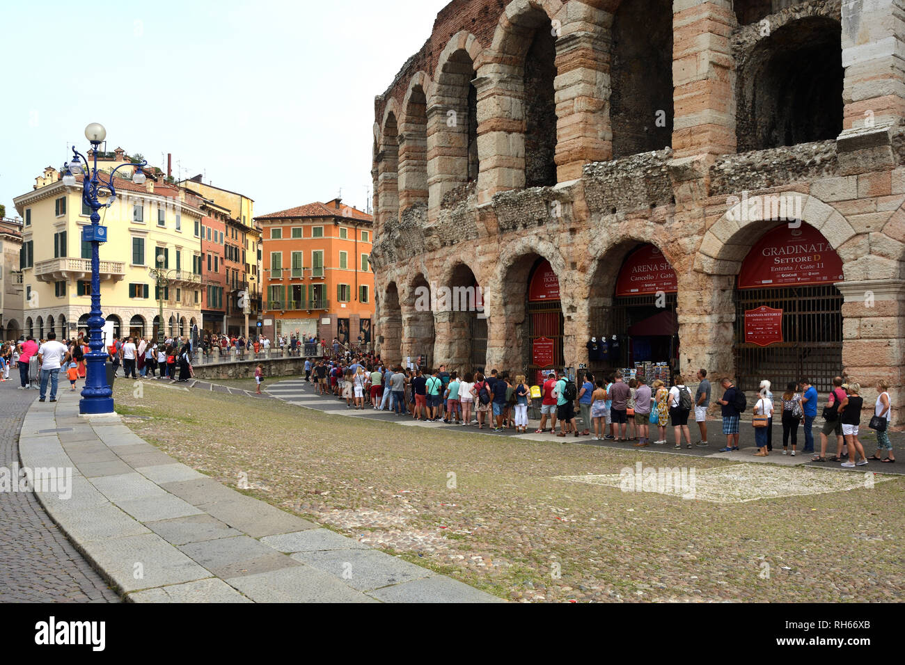 Visitors in front of the main entrance to the Roman amphitheatre Arena ...
