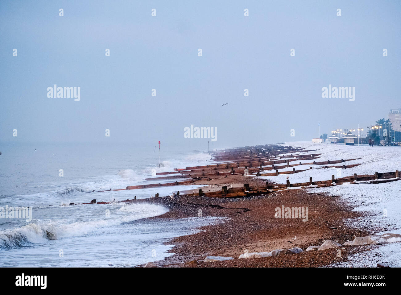 Snow meets the sea on at beach hi-res stock photography and images - Alamy