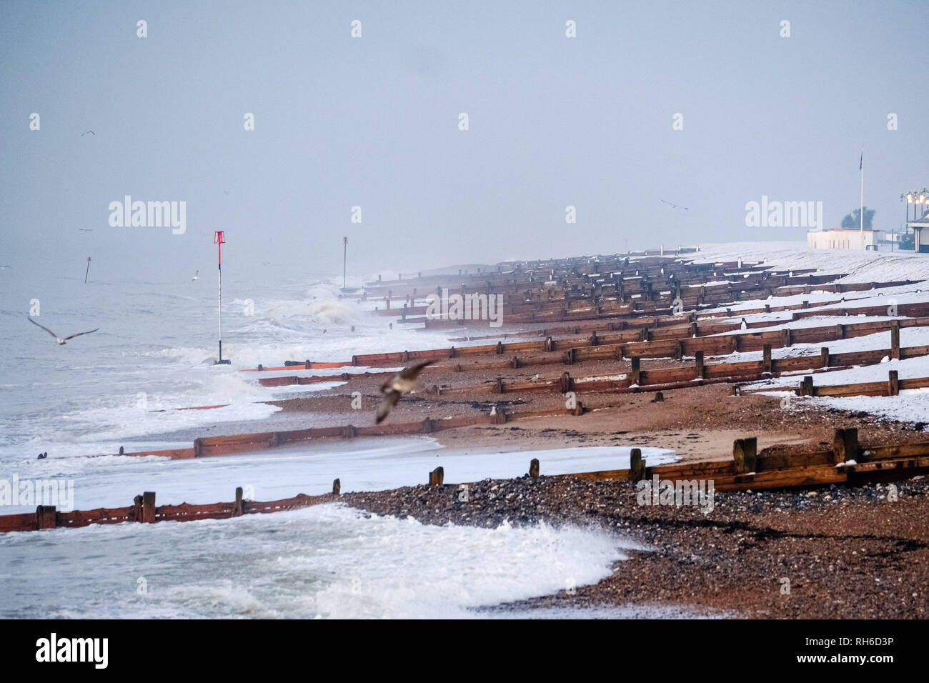Snow meets the sea on at beach hi-res stock photography and images - Alamy