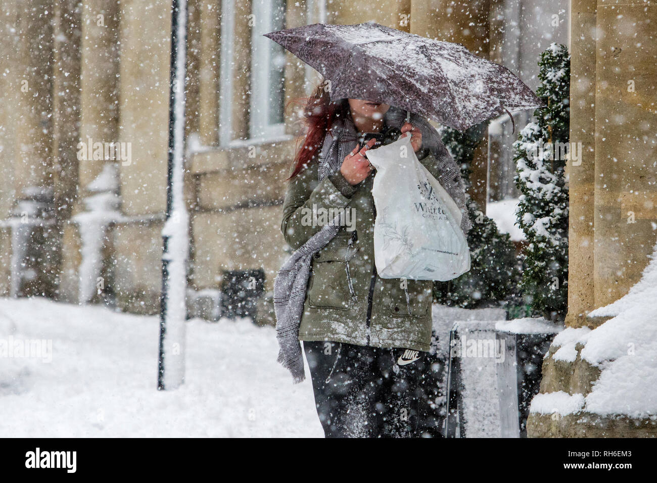 Uk people walking in snow storm blizzard hi-res stock photography and ...
