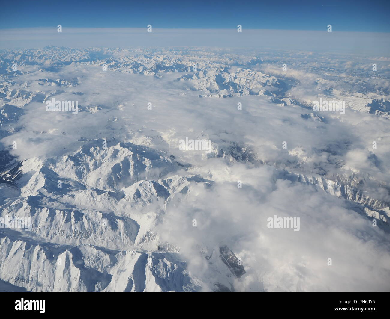 Aerial landscape of the Alps in Europe during winter season with fresh ...