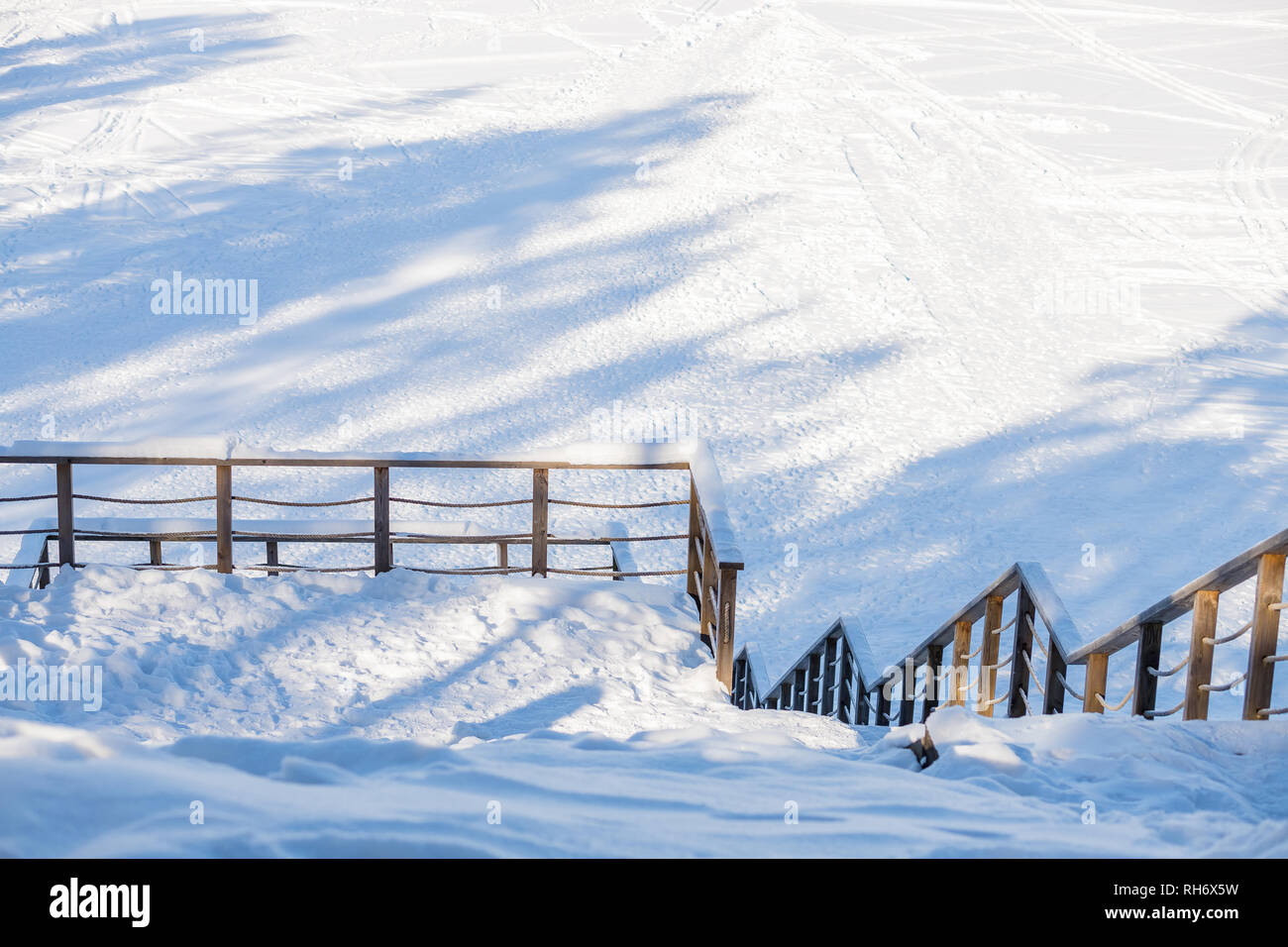 Outdoor stairs full of ice and snow.The wooden stairs in the mountain ...