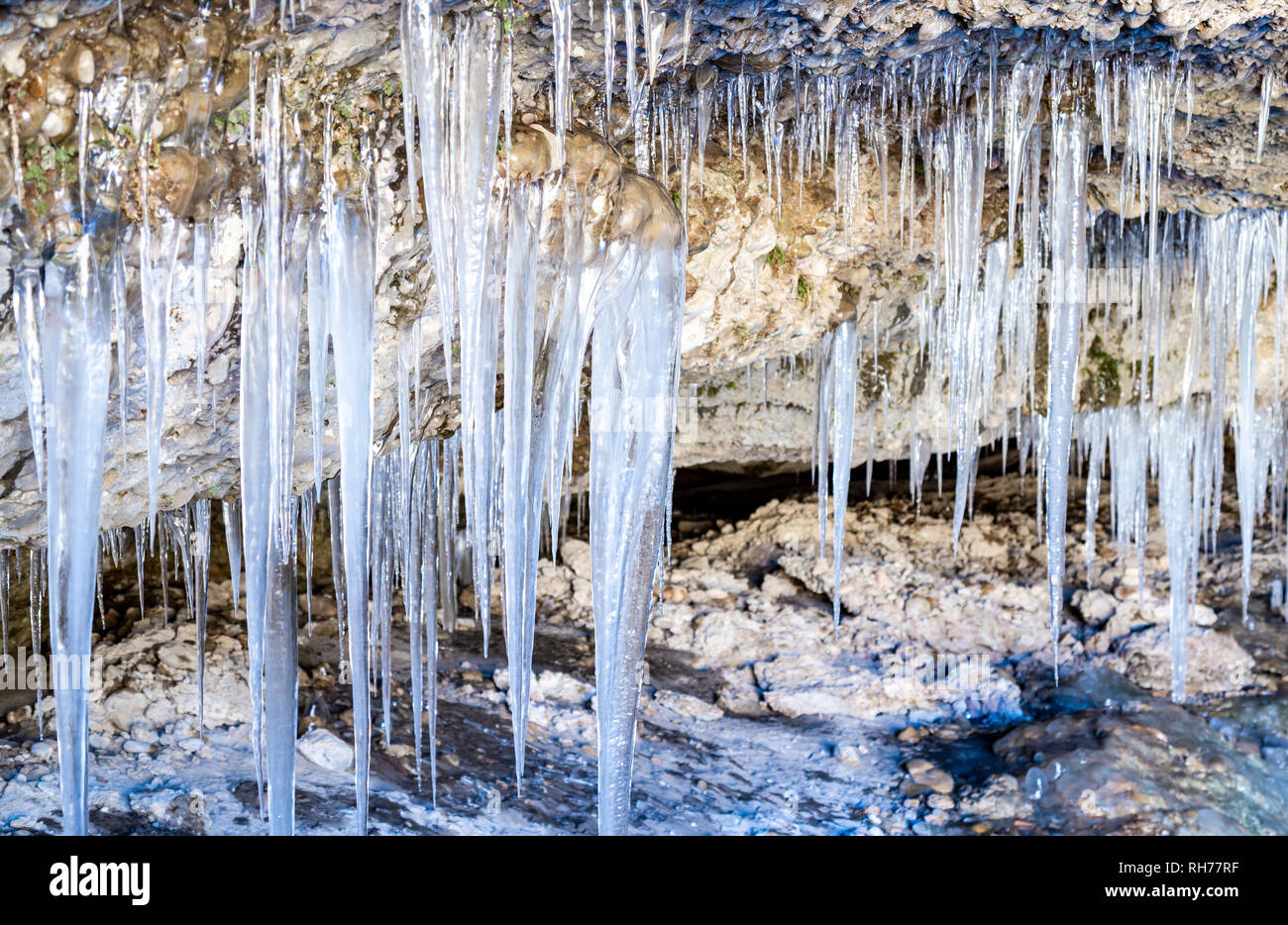 Many icicles hanging from the ceiling of the cave Stock Photo - Alamy