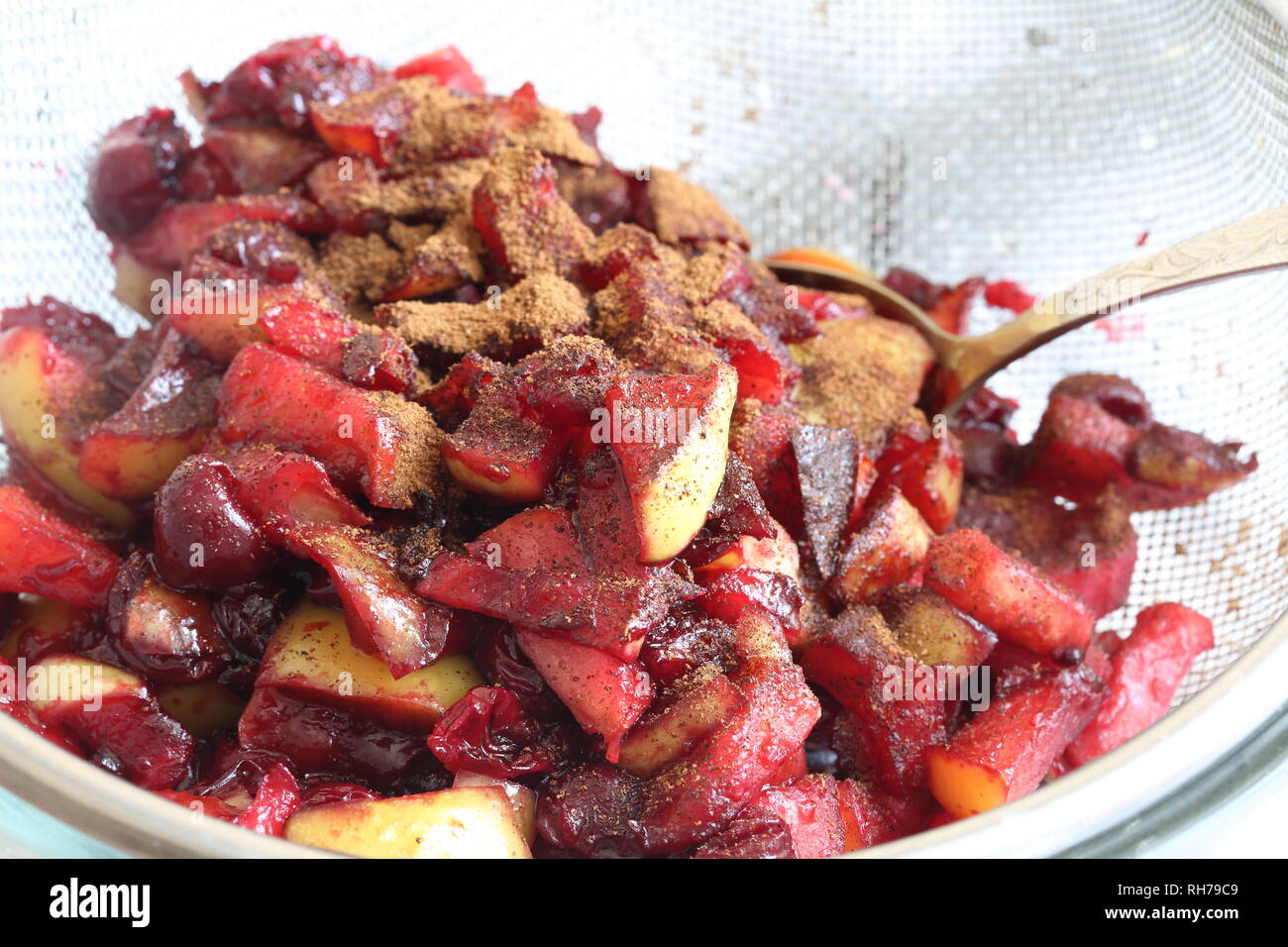 Apple cherry strudel cooking Stock Photo - Alamy