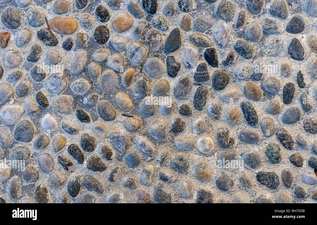 pavement with small pebbles in Italy Stock Photo - Alamy