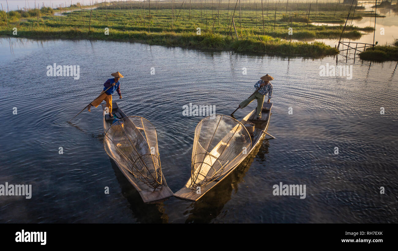Lake Inle/ Myanmar- January 12,2019: two traditional Intha fishermen ...