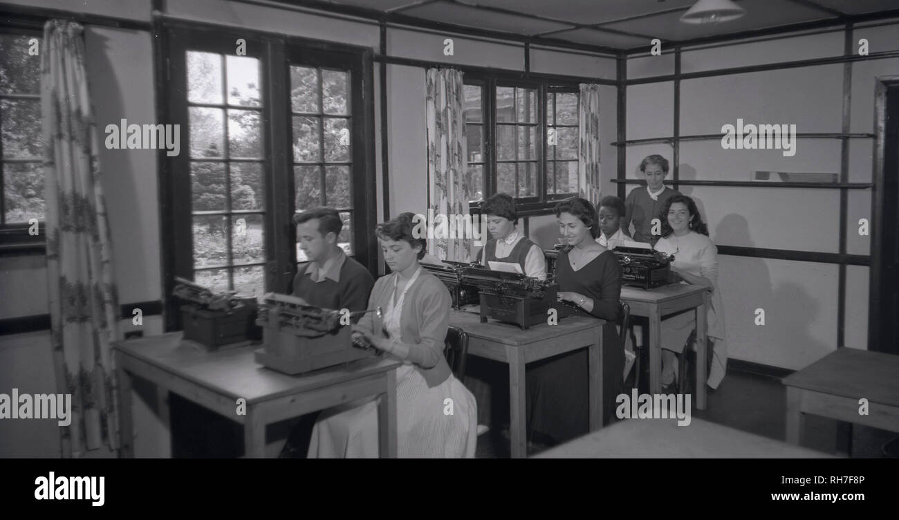 1950s, historical picture of a typing class, showing male and female ...