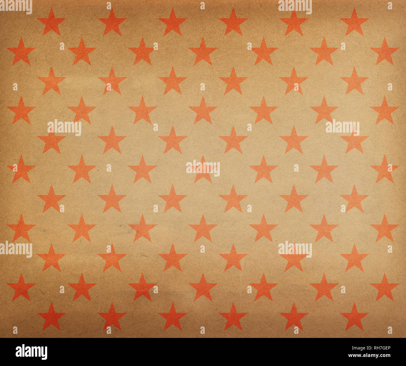 Vintage red stars pattern wrapping paper on a gold background Stock ...