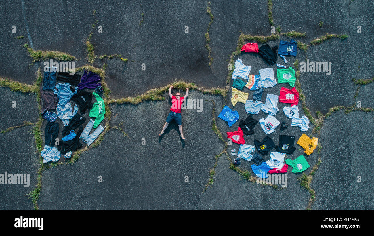 Knolling man holding up crack connecting clothing wardrobe Stock Photo ...