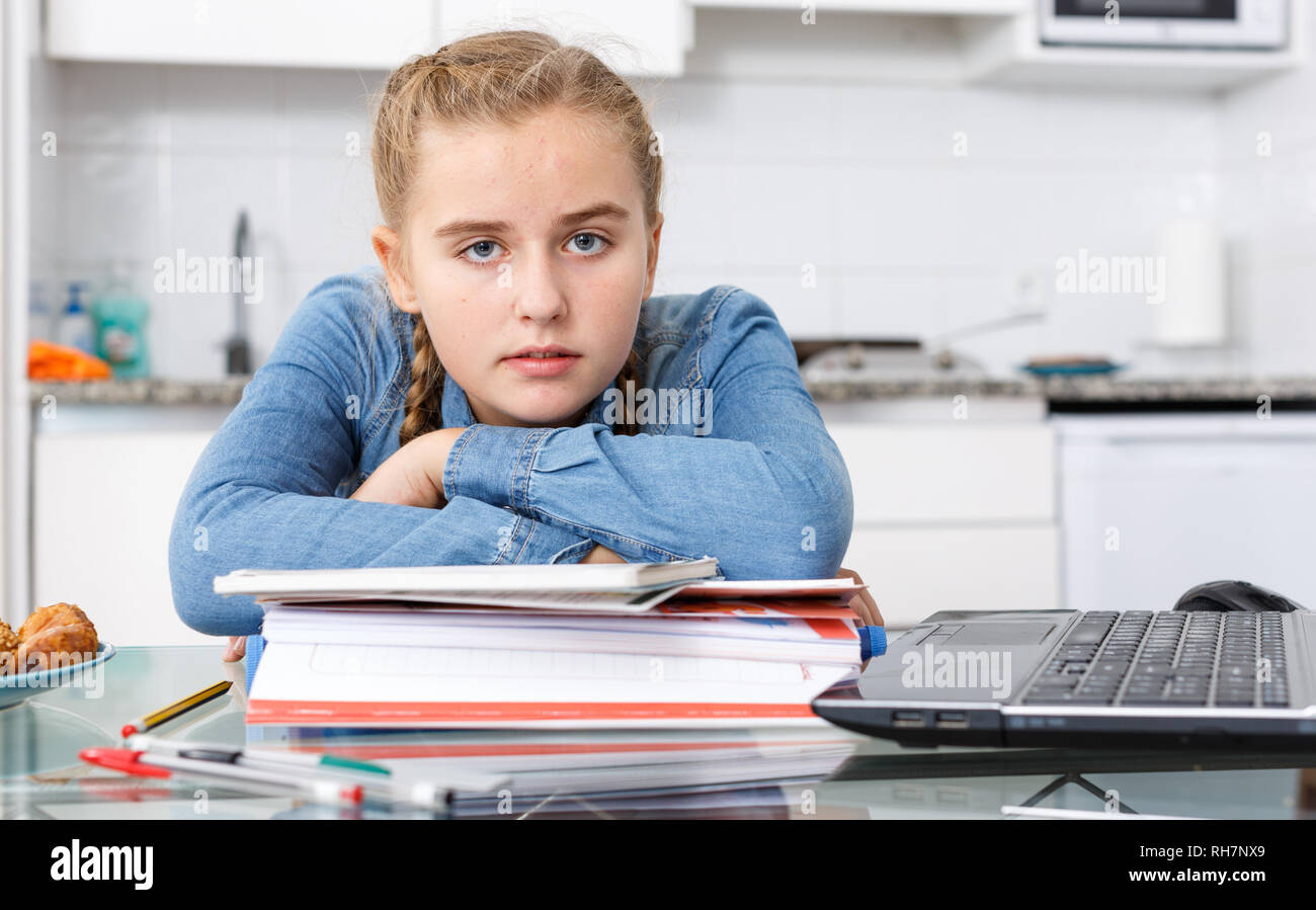 Portrait of teenage girl with sad face expression because she is tired ...