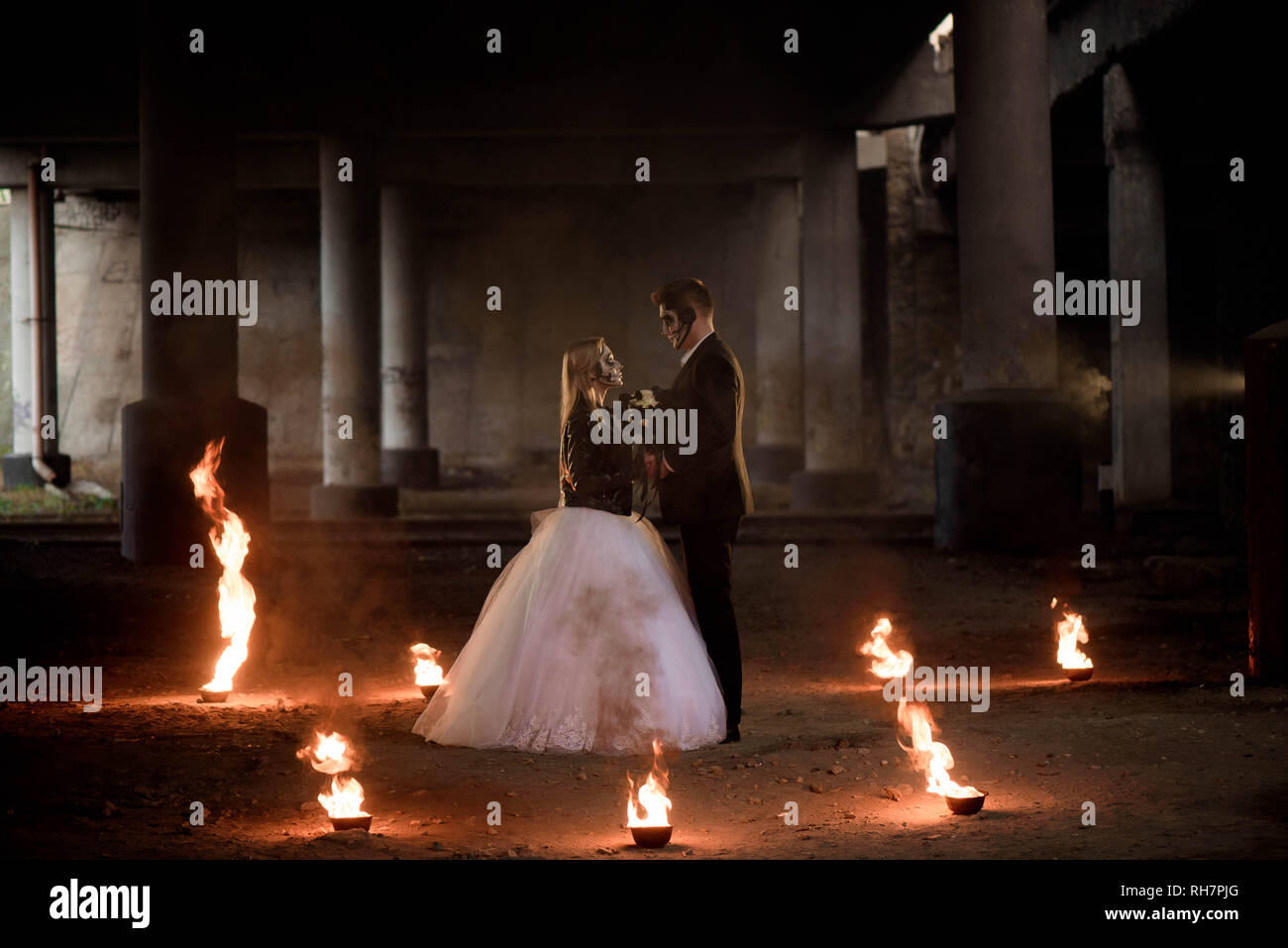 Dressed in wedding clothes romantic zombie couple Stock Photo - Alamy
