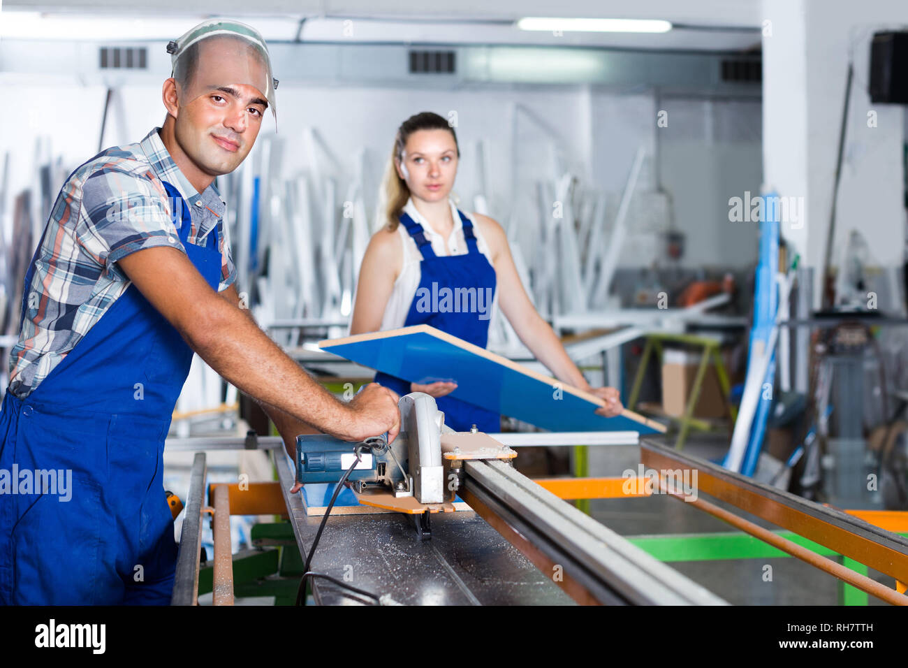 Craftsman is ready to work on circular saw in assembly shop with his ...
