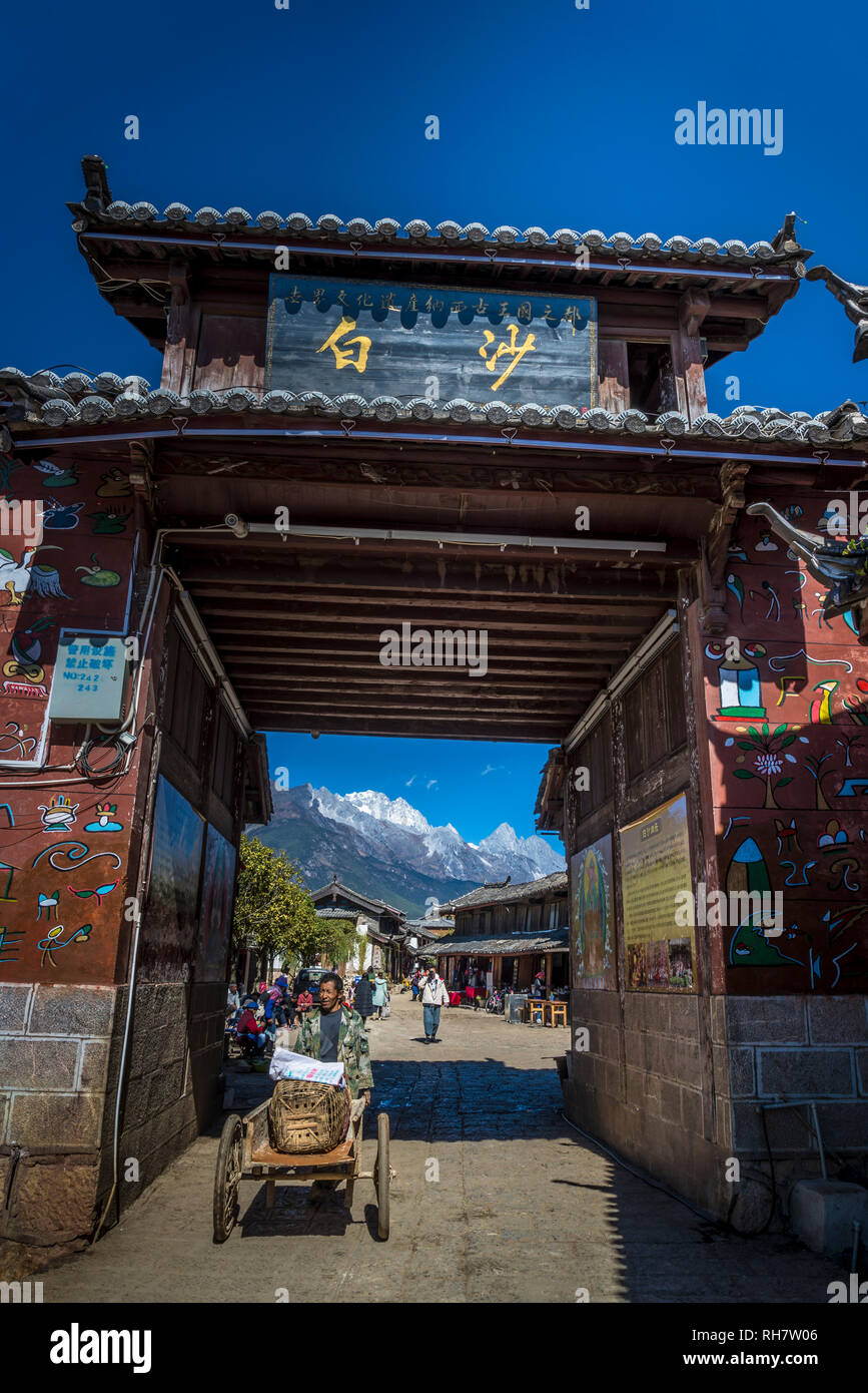 Baisha Old Town, Arch into the town with Jade Dragon Snow Mountain in ...