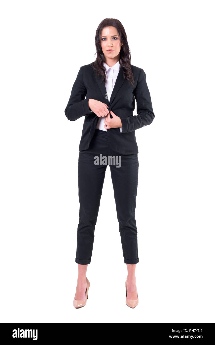 Serious confident business woman getting dressed in formal clothes ...