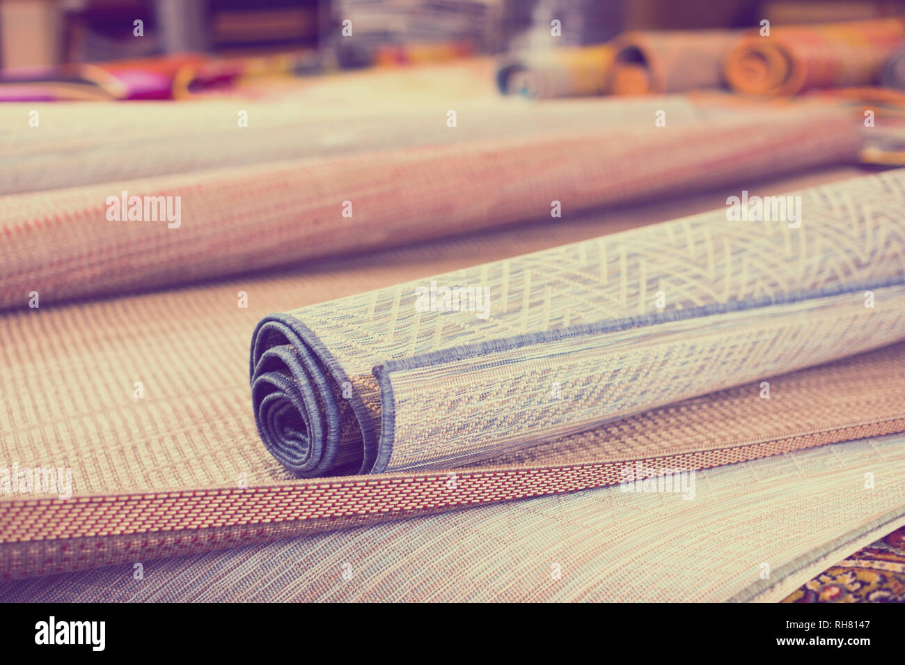 diversity of straw carpets in the store for home decor Stock Photo - Alamy