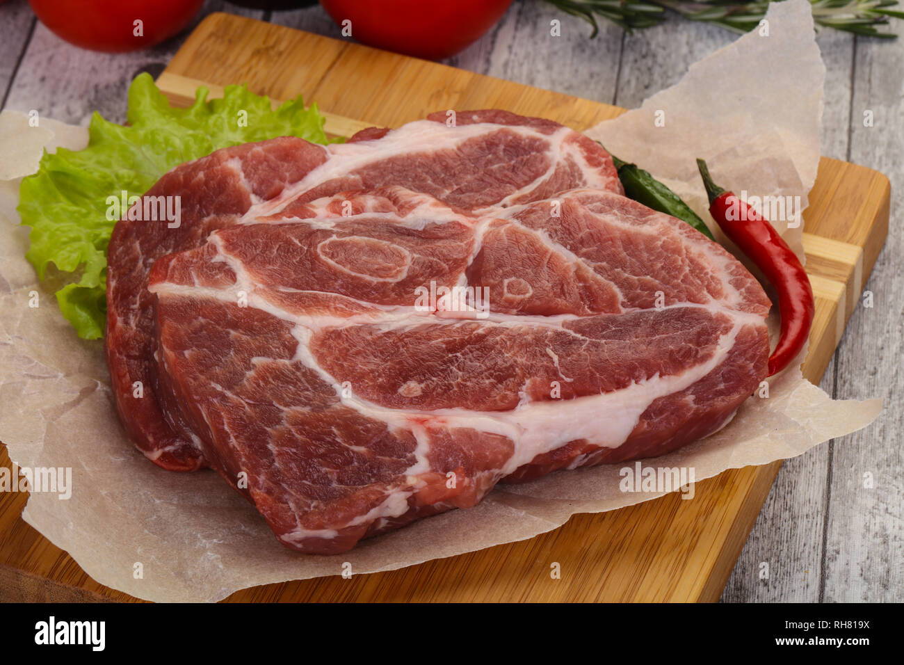 Raw pork neck steak ready for cooking Stock Photo - Alamy