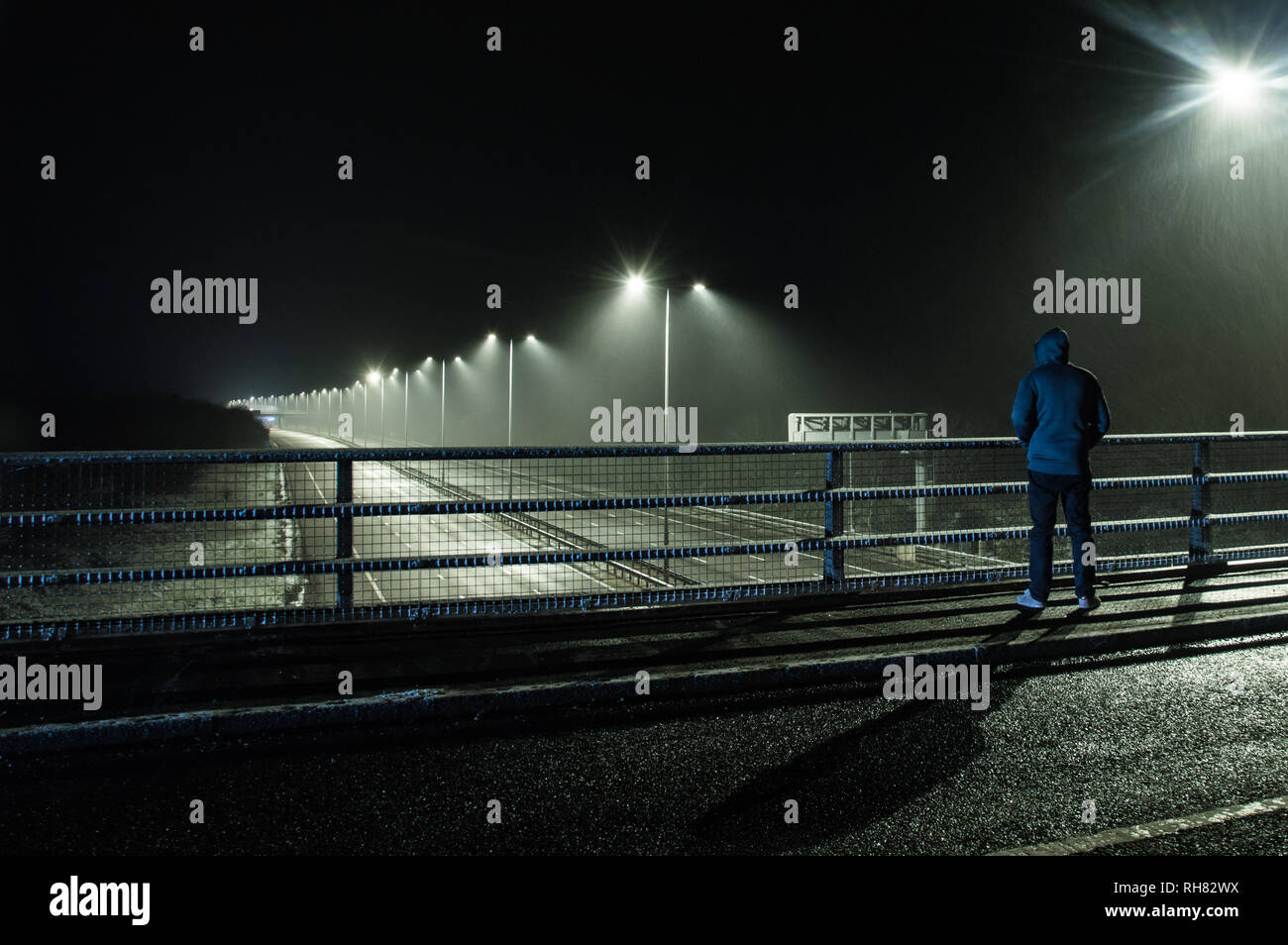 Looking Down From A Bridge At Night