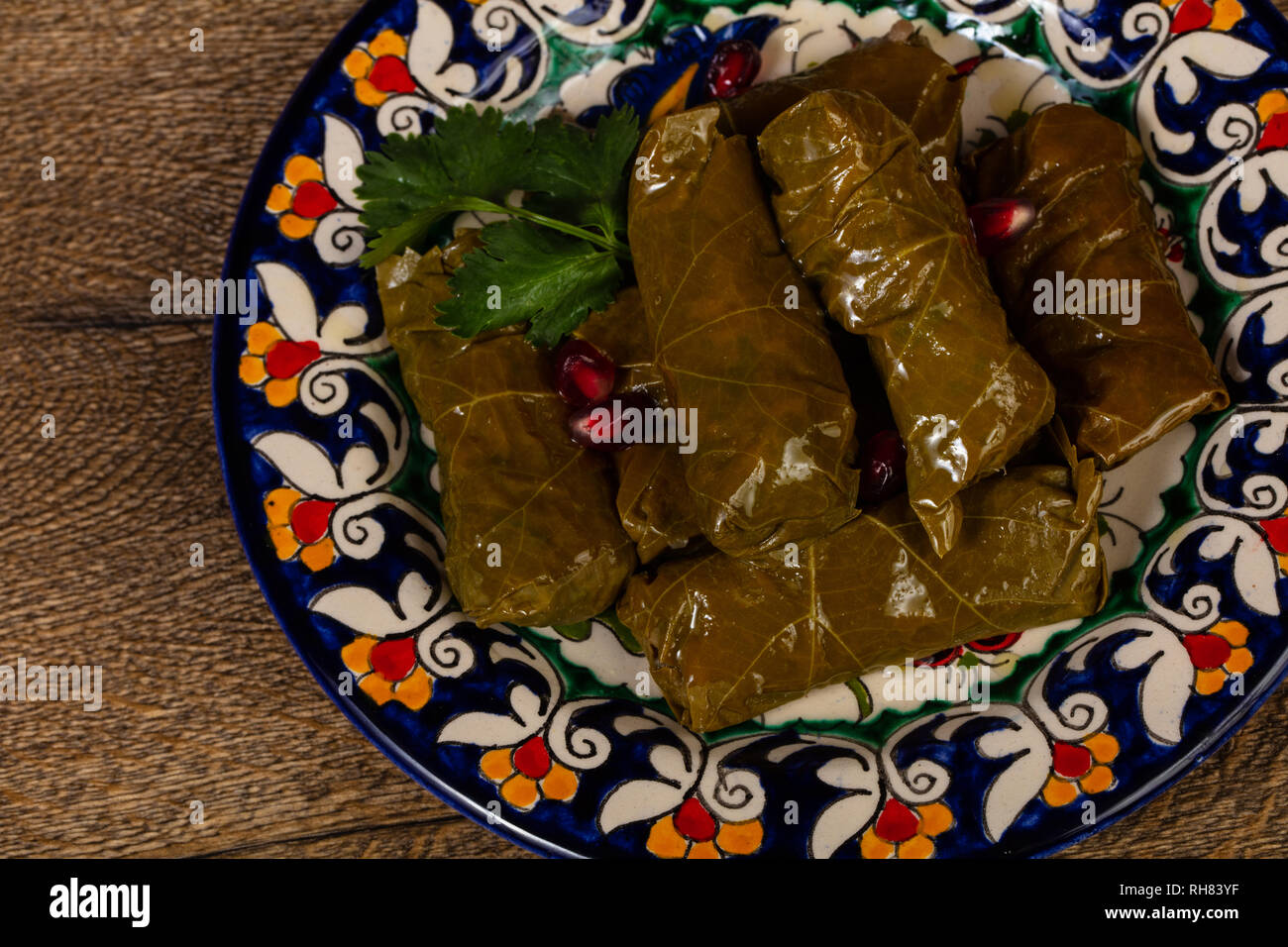 Caucasian traditional Dolma - minced meat in grape leaves Stock Photo ...