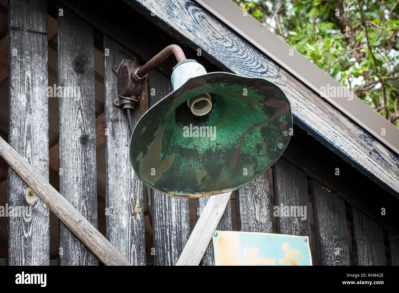 Metallic broken lamp in old wooden barn Stock Photo - Alamy