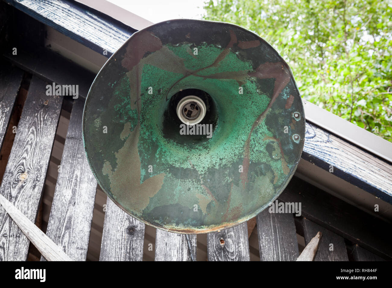 Metallic broken lamp in old wooden barn Stock Photo - Alamy