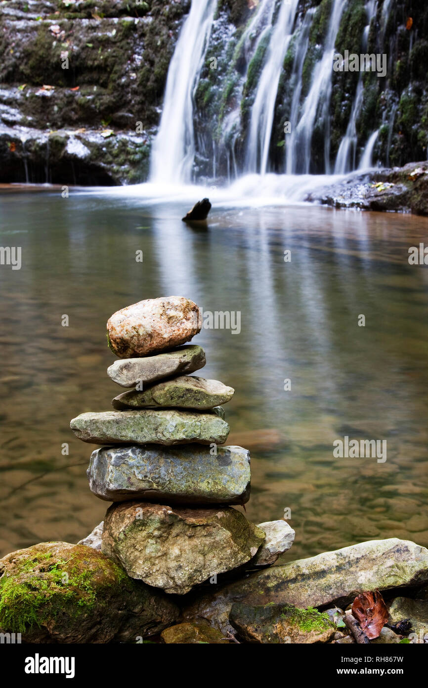 Balanced stones on a waterfall Stock Photo - Alamy