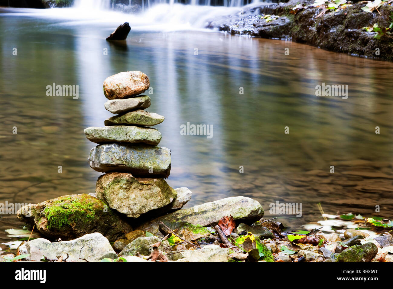 Balanced stones on a waterfall Stock Photo - Alamy