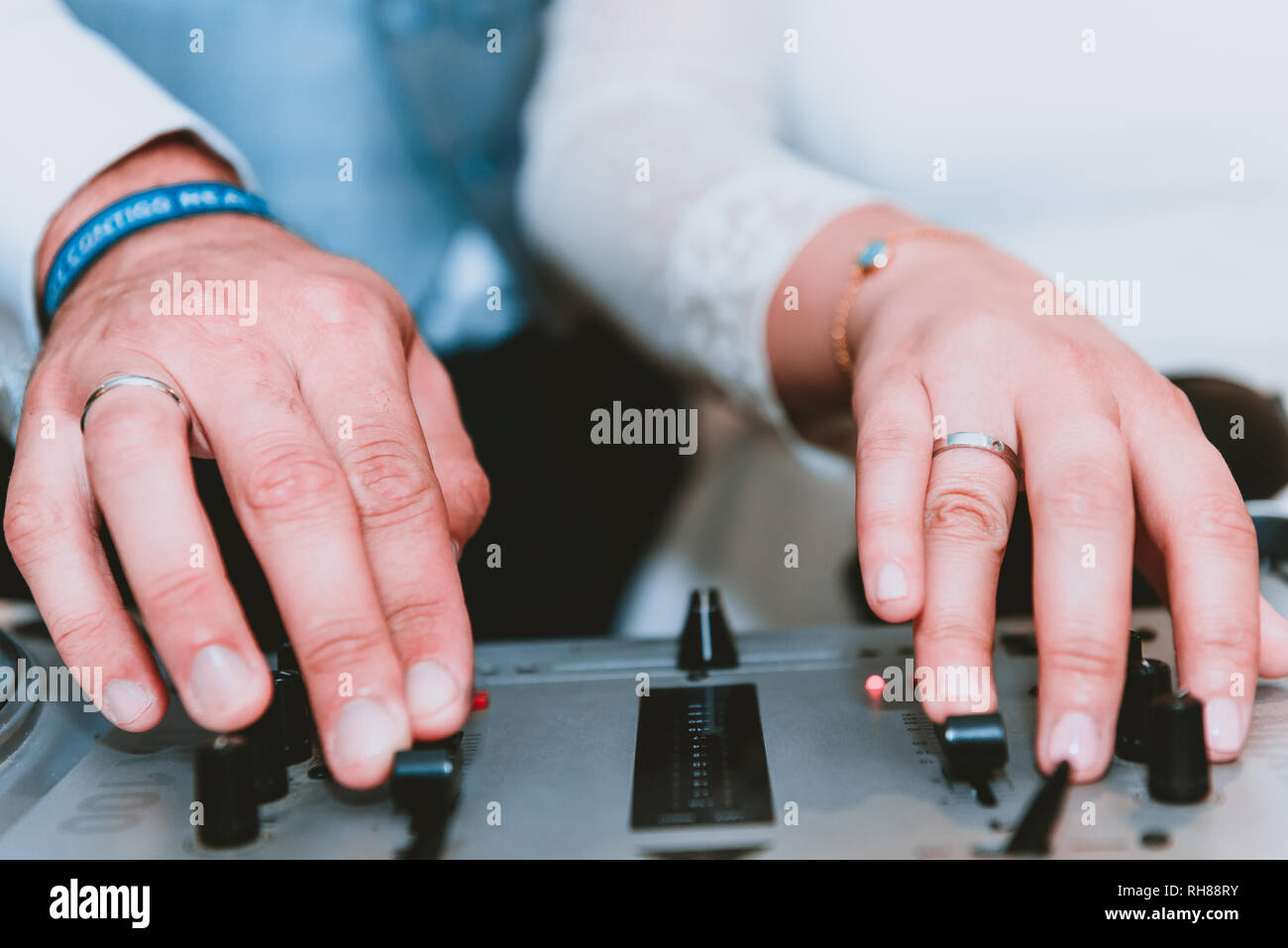 Crop man using music equalizer Stock Photo - Alamy