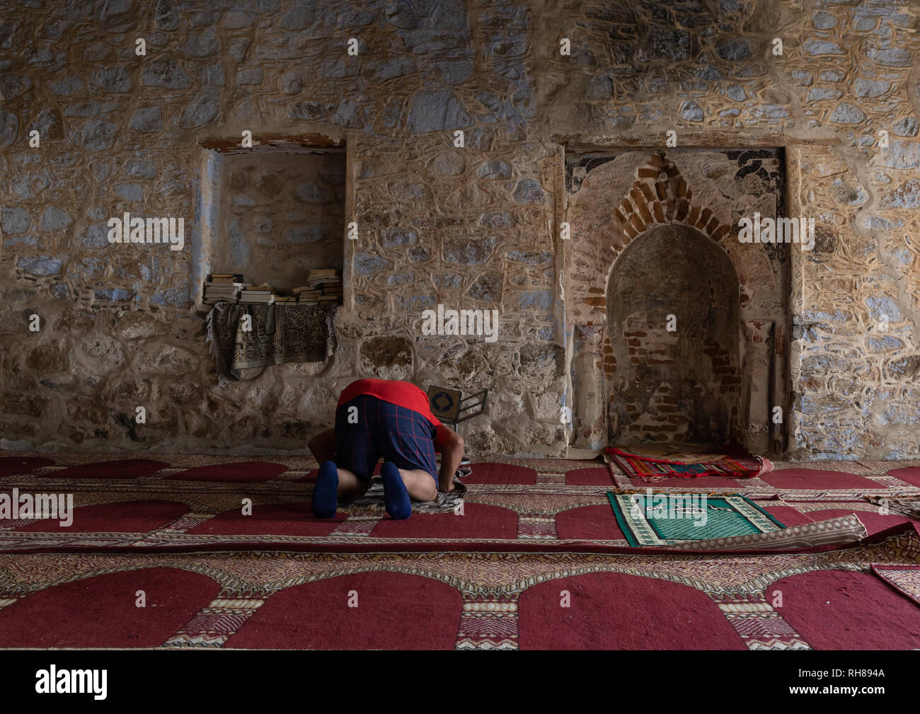 Saudi man praying in the ottoman qantara mosque also known as al ...