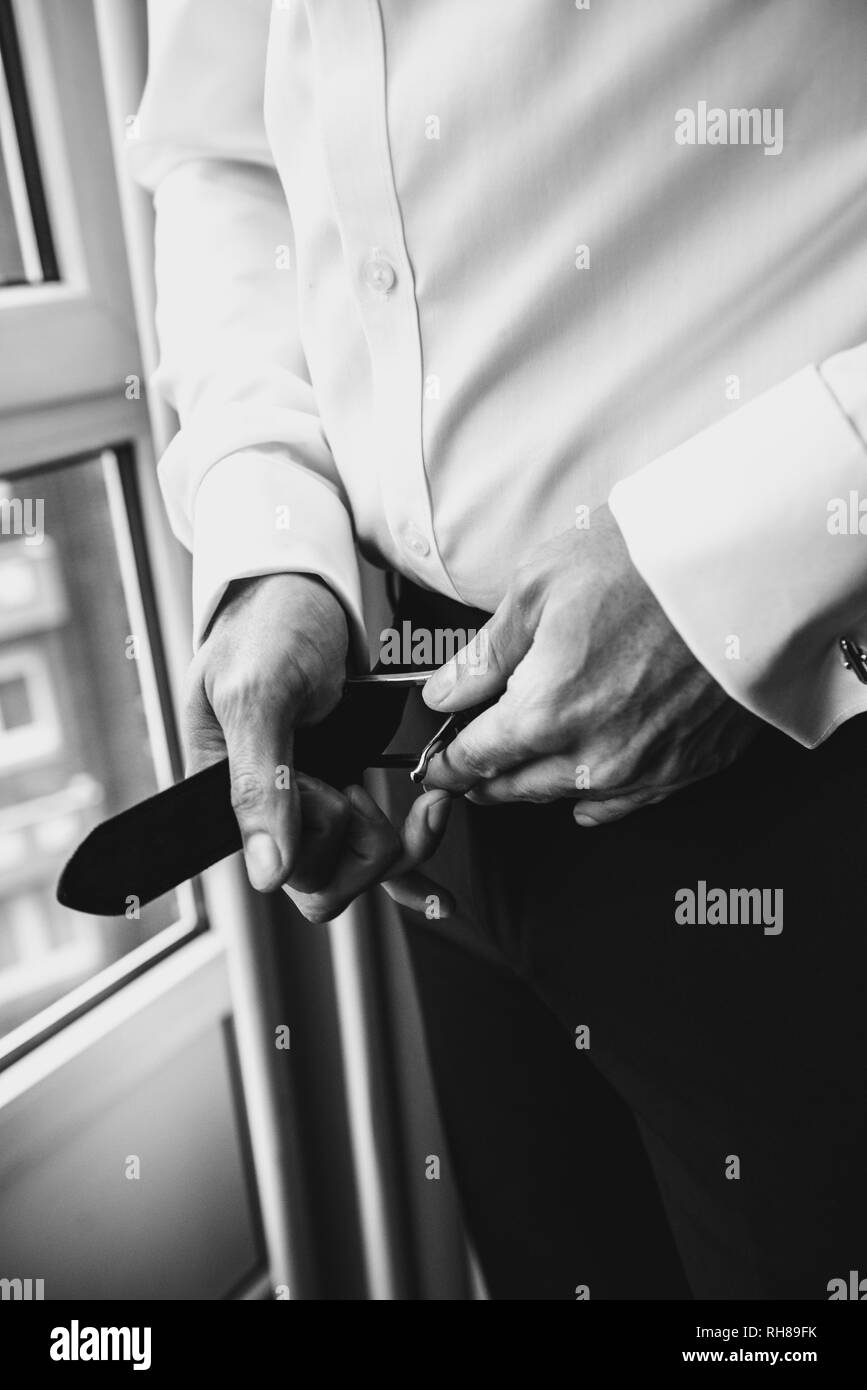 Buttoning pants Black and White Stock Photos & Images - Alamy