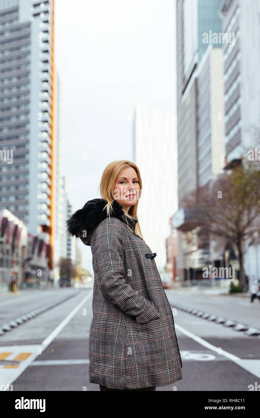Blonde girl posing in the city Stock Photo - Alamy
