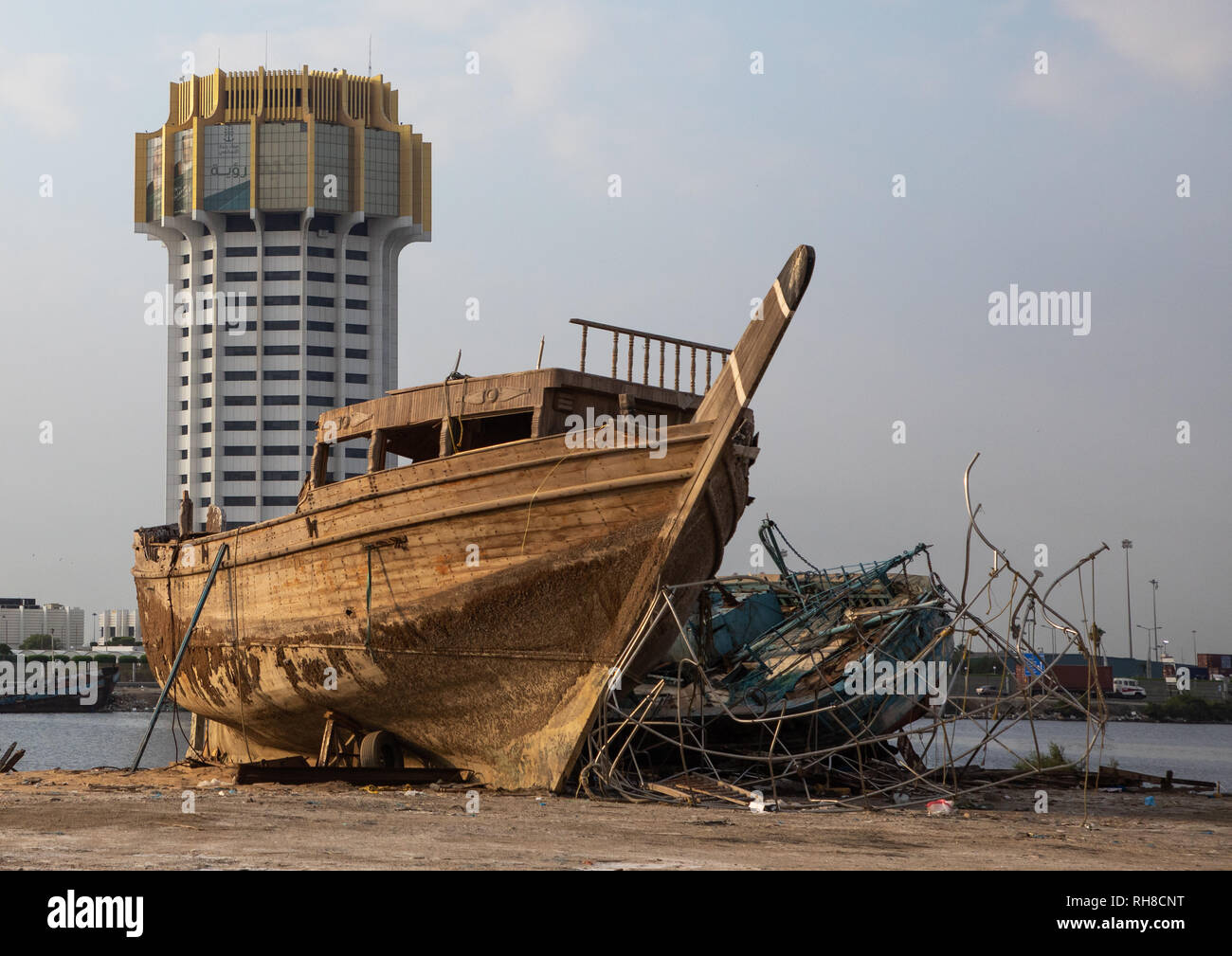 Old fishermen boats in front of the islamic port tower, Mecca province ...