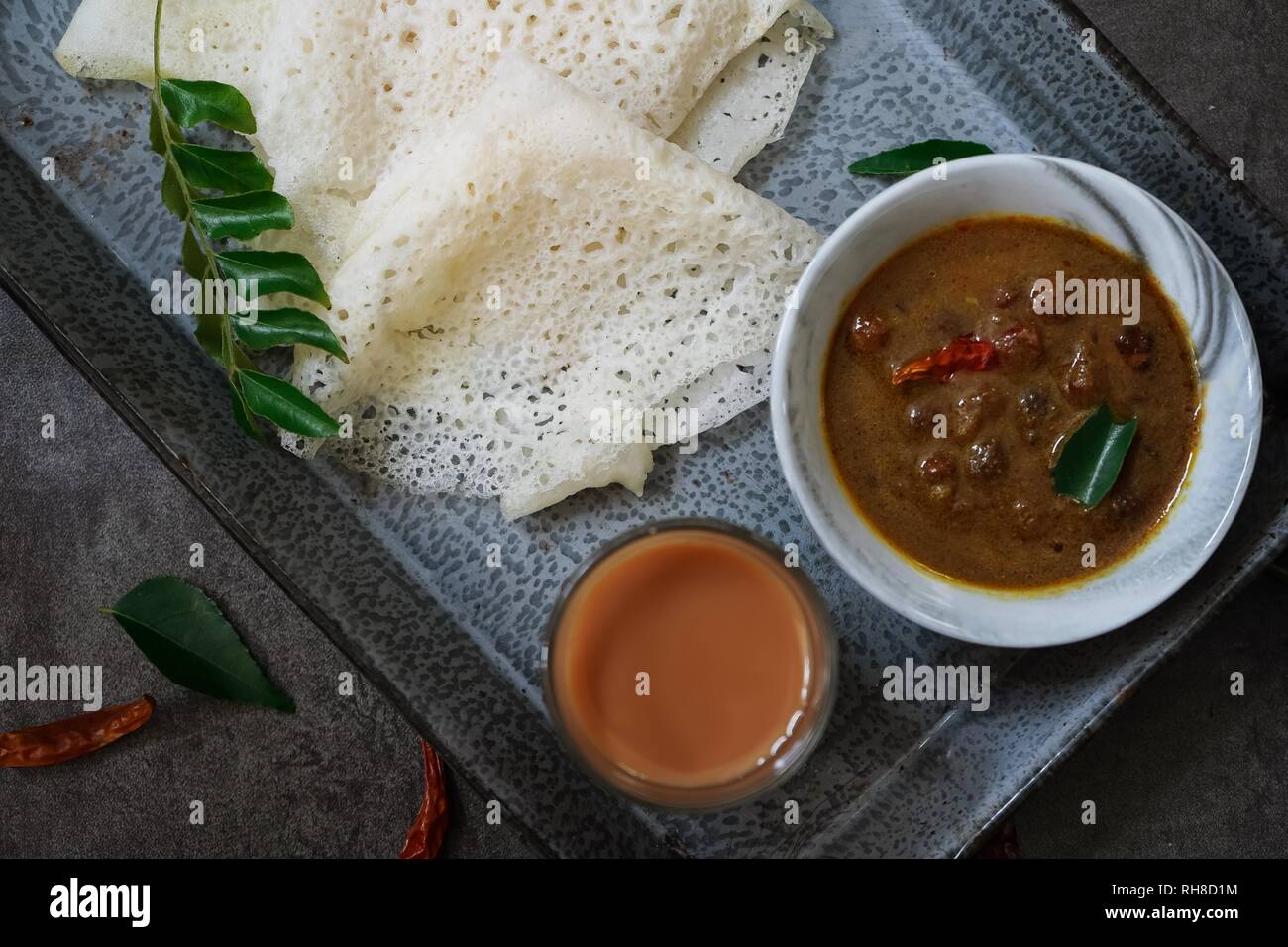 Neer Dosa / South Indian rice Crepes with channa curry tea served in a ...